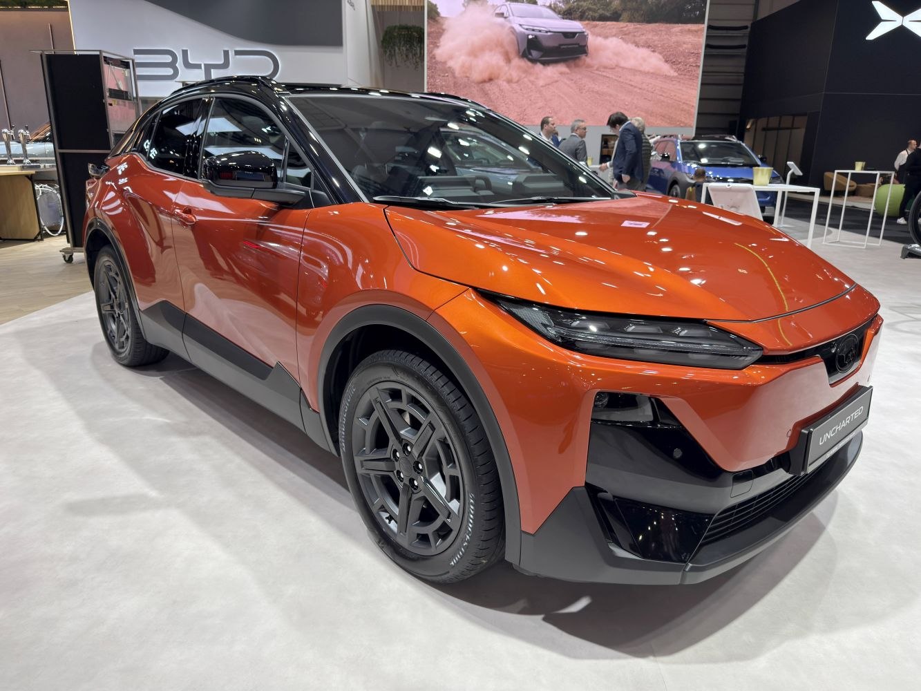 Futuristic Angular Headlights and Orange Two-Tone SUV Design