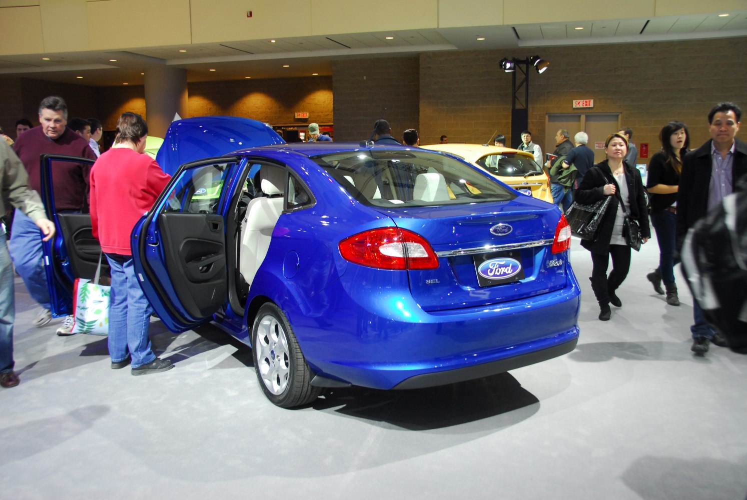 Blue Four-Door Compact Sedan at Auto Show Showcase